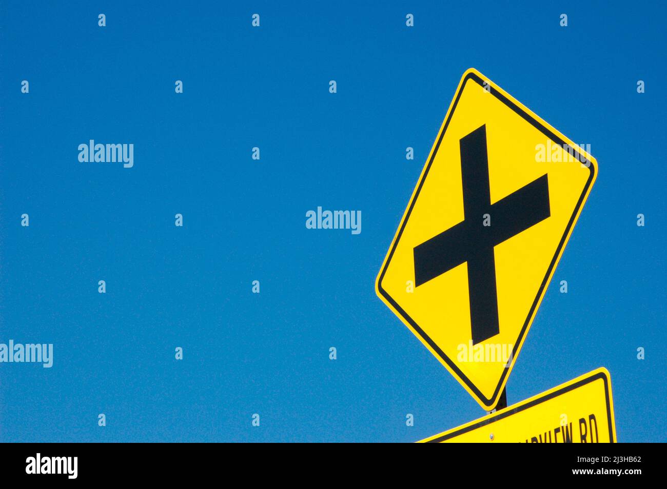 cross roads ahead signs for drivers to see on freeway and roads and ...