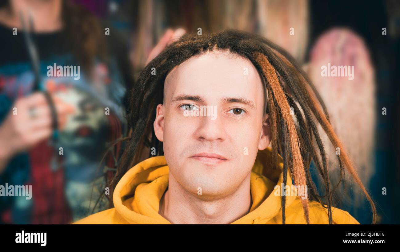 Professional hairstylist makes brown dreadlocks for client Stock Photo ...