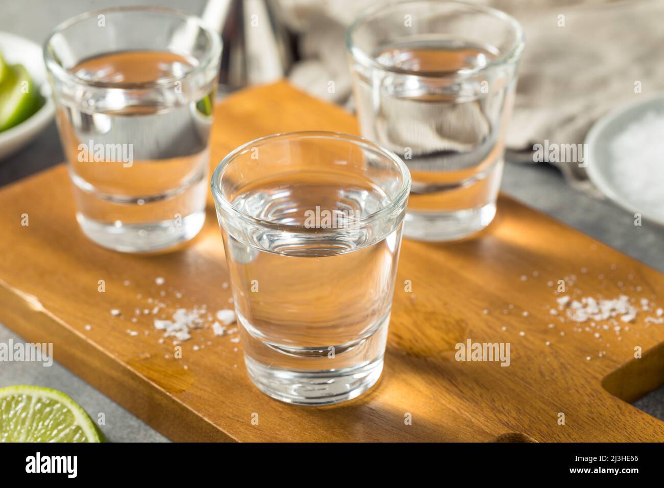Boozy Refreshing Tequila Shots with Lime and Salt Stock Photo - Alamy