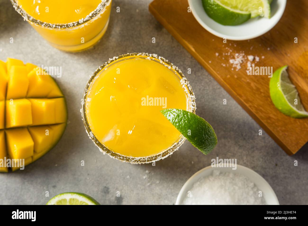 Boozy Cold Mango Margarita Cocktail with LIme and Salt Stock Photo - Alamy