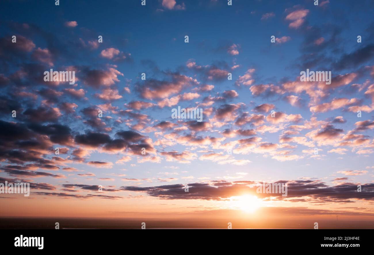 Natural abstract background. Morning dawn sky, clouds illuminated by ...