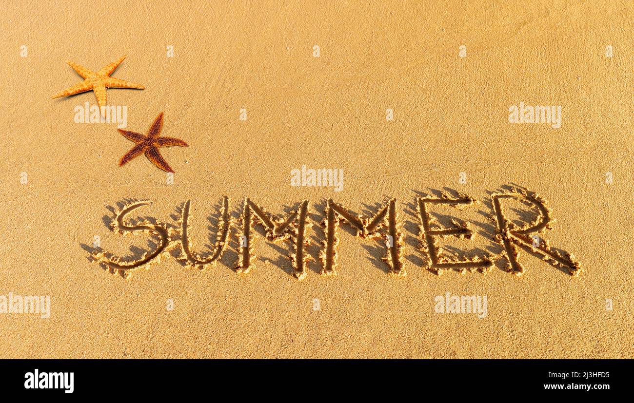 The word summer written in sand Stock Photo - Alamy