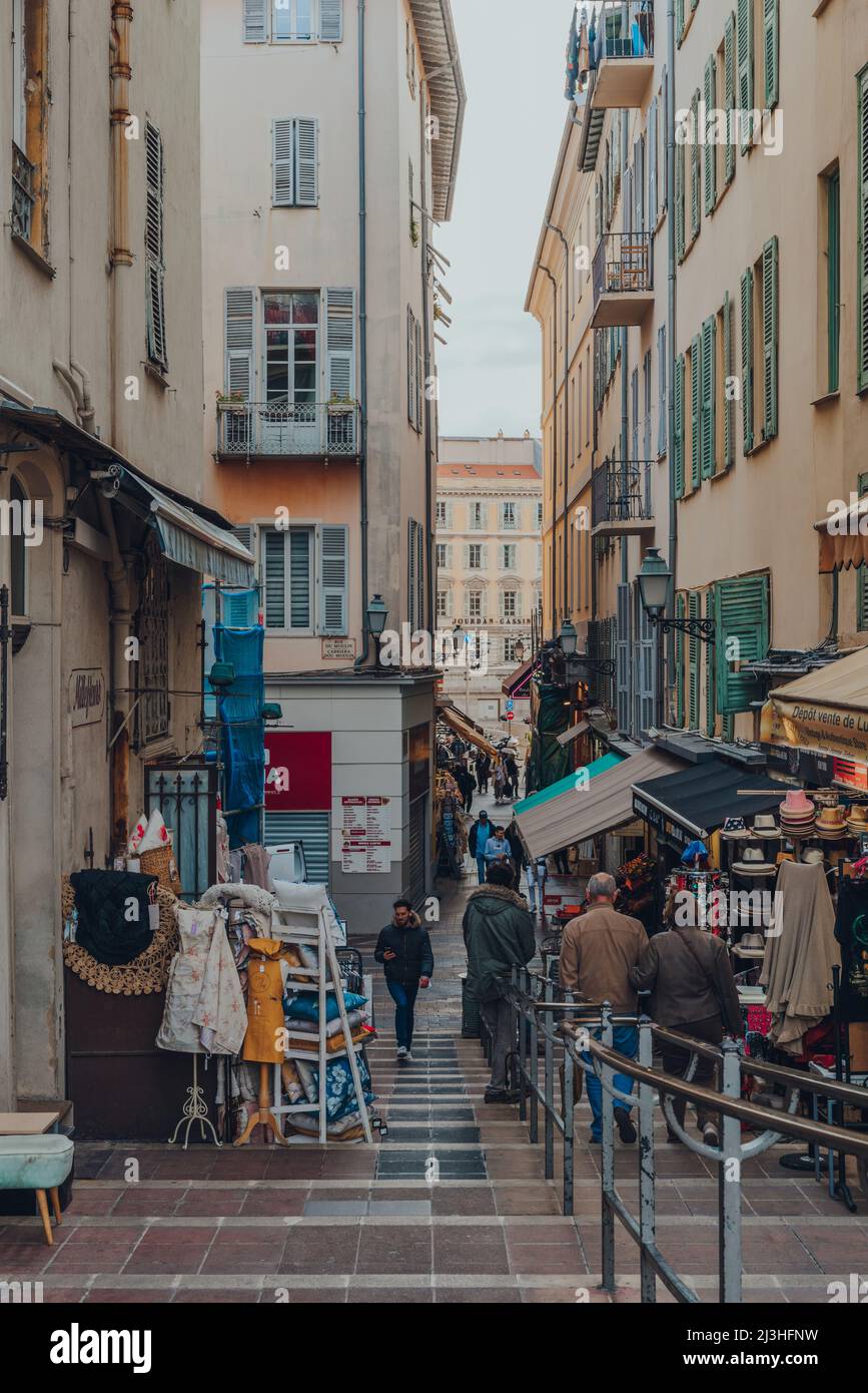 Nice, France - March 10, 2022: People walking past the shops on a ...