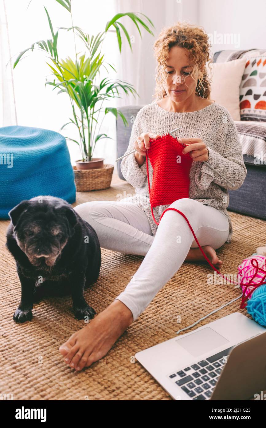 Instruction by online tutorial on laptop computer hi-res stock ...