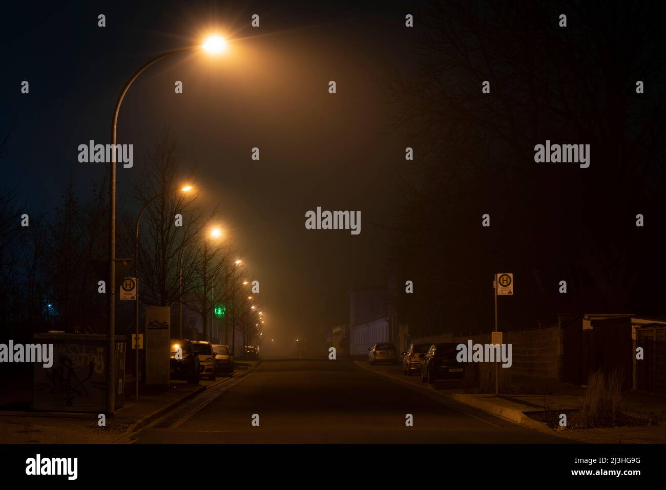 A little fog at night under the street lights hi-res stock photography ...