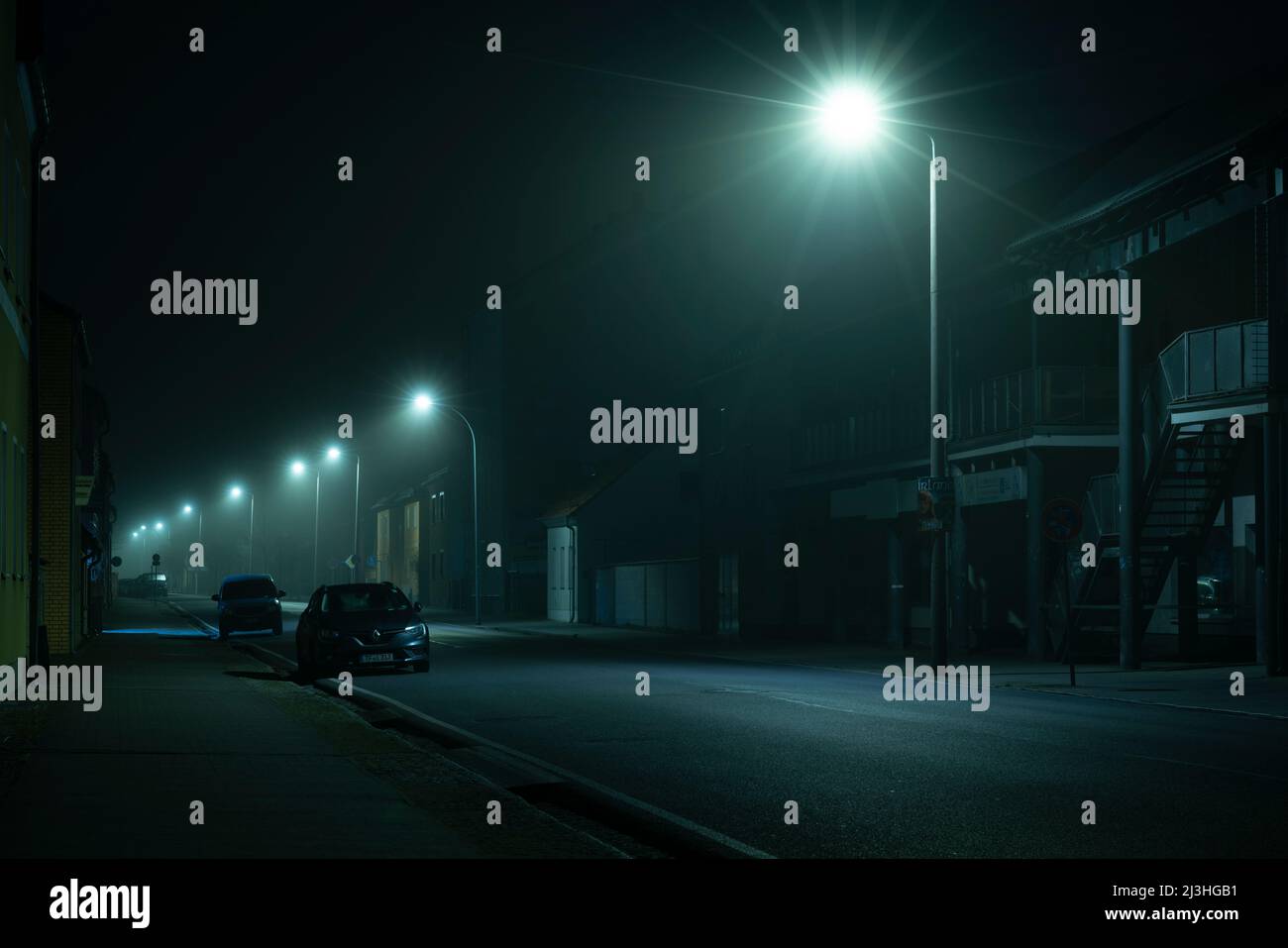 A little fog at night under the street lights hi-res stock photography ...