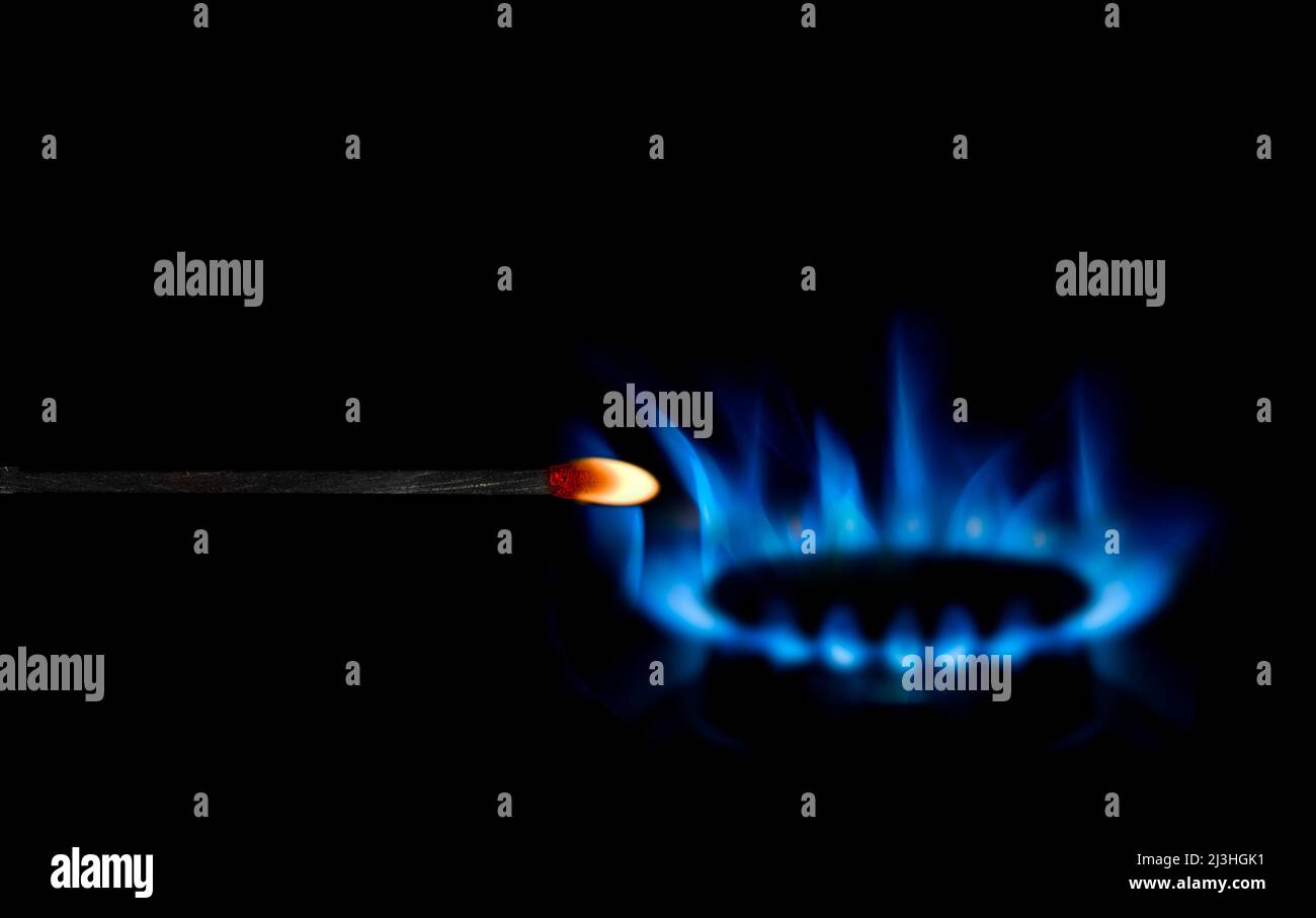 Blue gas flames against dark background Stock Photo - Alamy