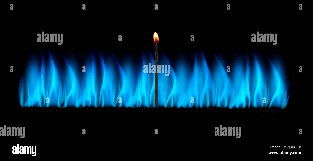 Blue gas flame against dark background Stock Photo - Alamy