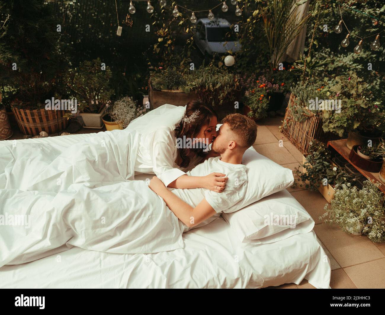 Married couple laying on bed hi-res stock photography and images - Alamy