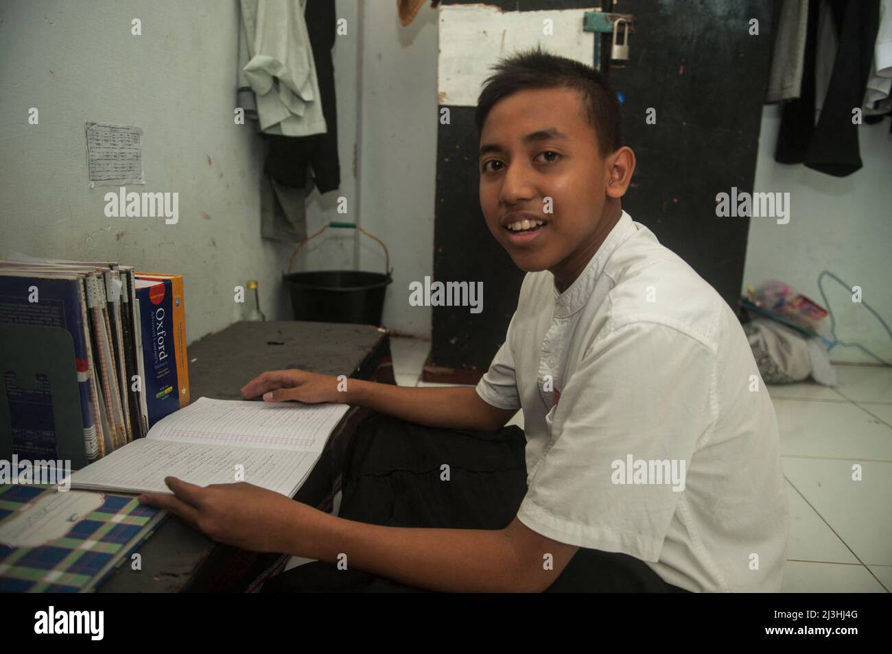 A student, Muhammad A Ibad, 16, seen inside his studied room at the Ar ...
