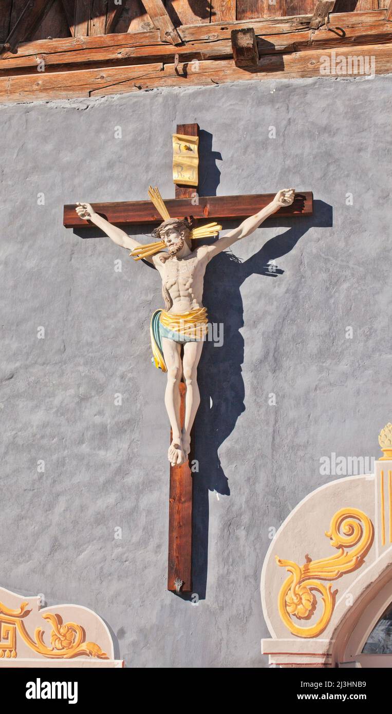 Jesus on the cross at an old house in mittenwald hi-res stock ...