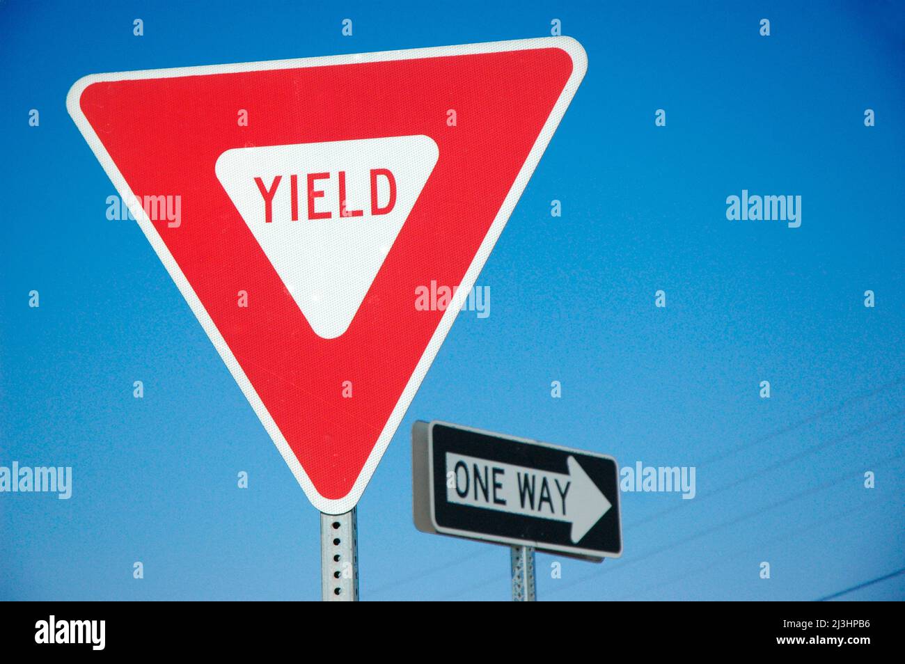 Yield and one way signs on freeway highway for drivers to see at ...