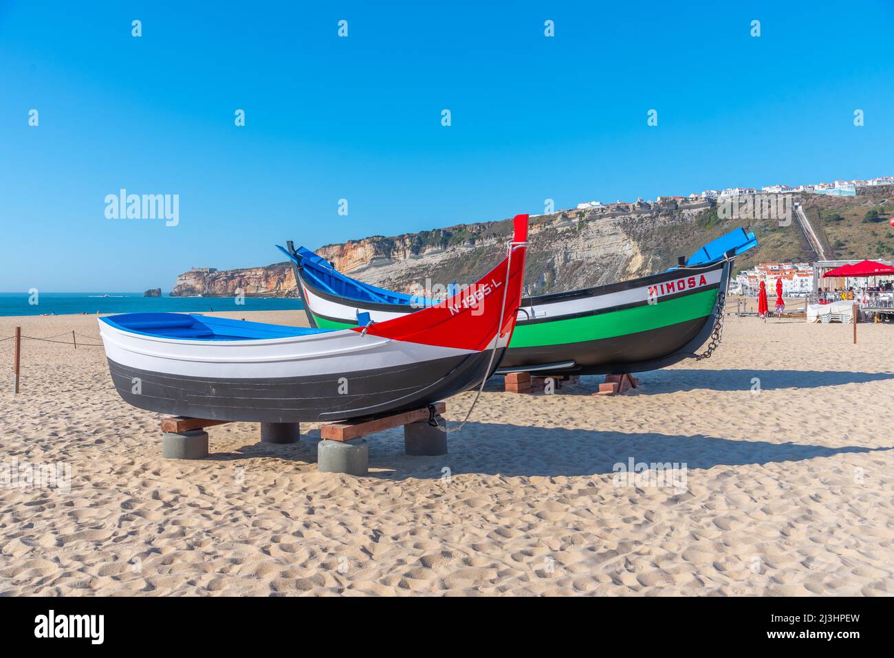 Wooden boats on beach at nazare, Portugal Stock Photo - Alamy