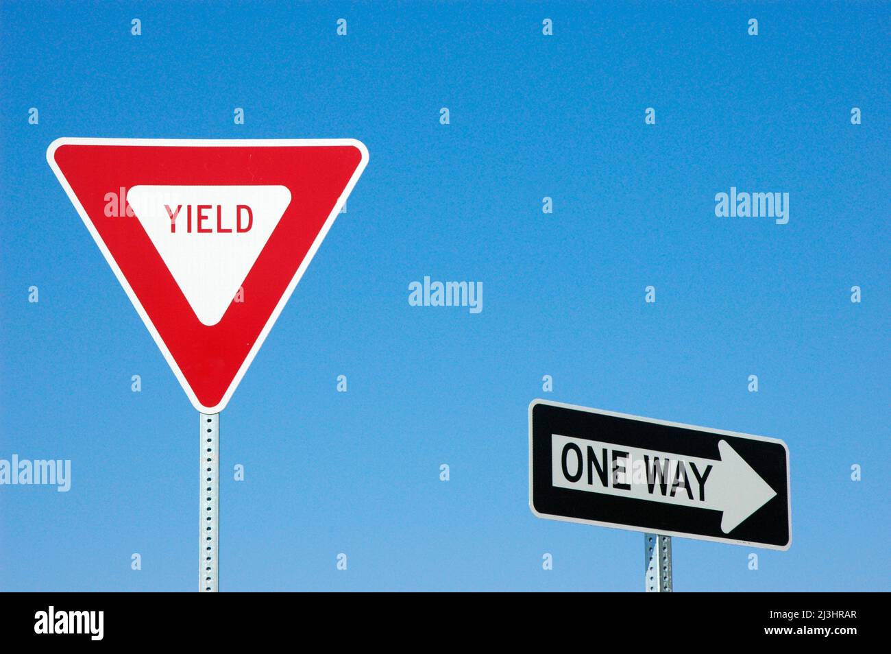 Yield and one way signs on freeway highway for drivers to see at ...