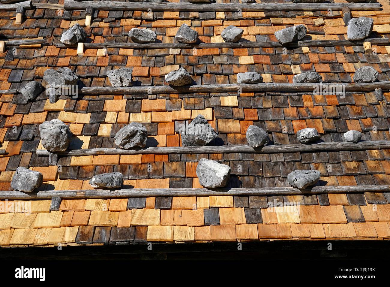Wooden shingle weighted with stones hi-res stock photography and images ...