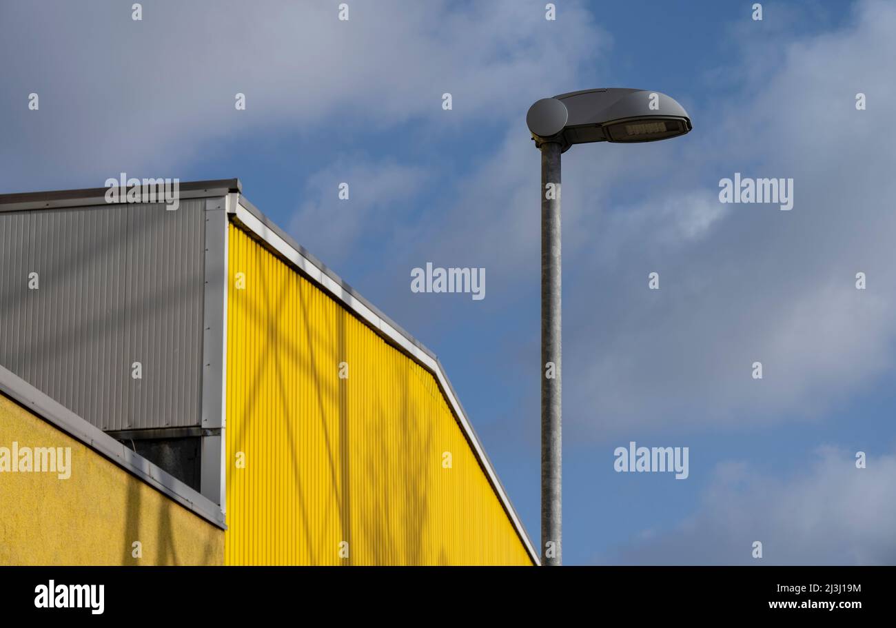 yellow warehouse, blue sky, lantern Stock Photo - Alamy