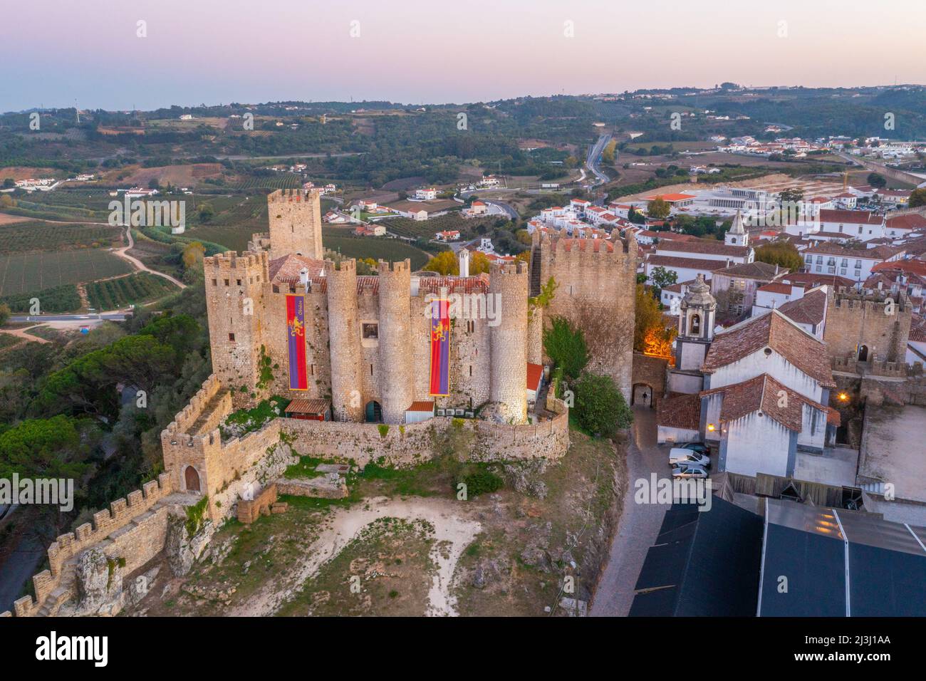 Sunset view of Obidos castle in Portugal Stock Photo - Alamy