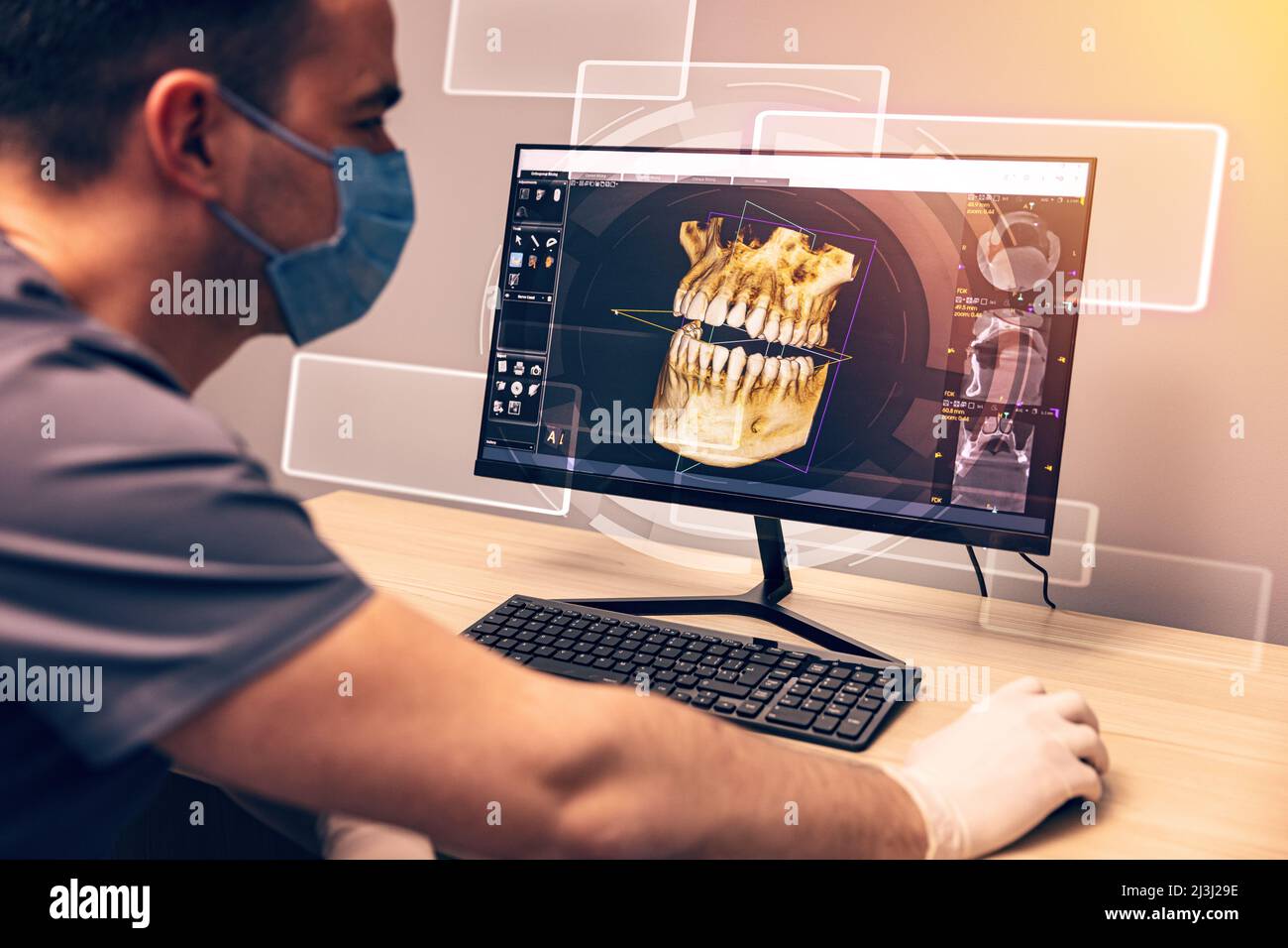 Attentive dentist examining an x-ray on computer in dental clinic Stock ...