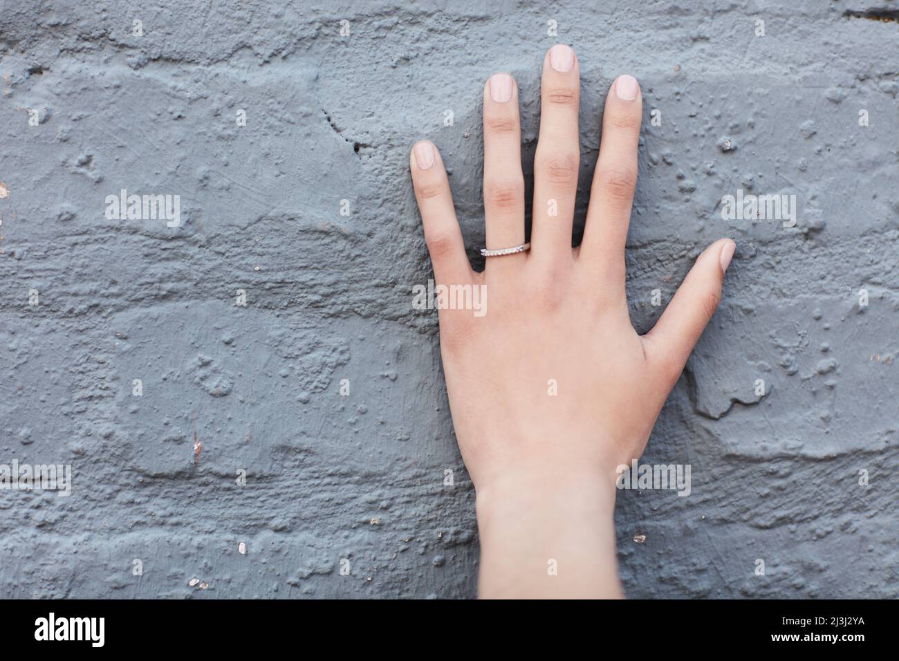 The symbol of commitment. Cropped shot of an engagement ring on an ...