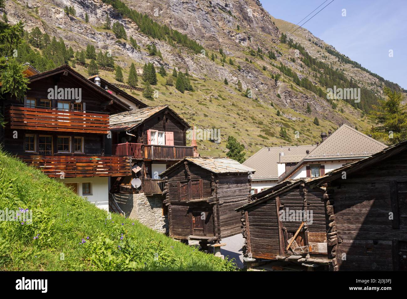 Village with traditional wooden graneries and houses on the Swiss Alps ...