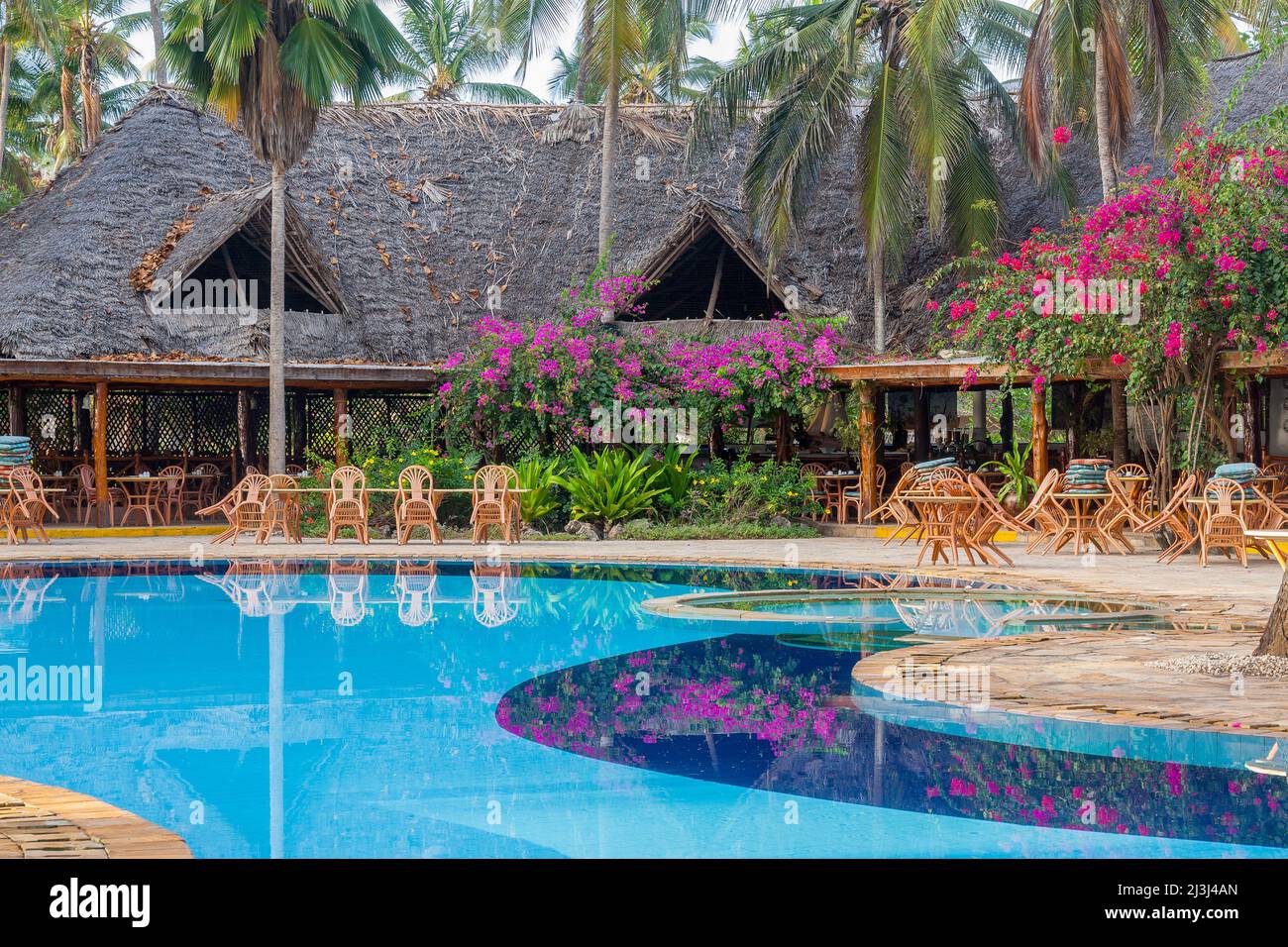Swimming pool of a tropical resort Stock Photo - Alamy