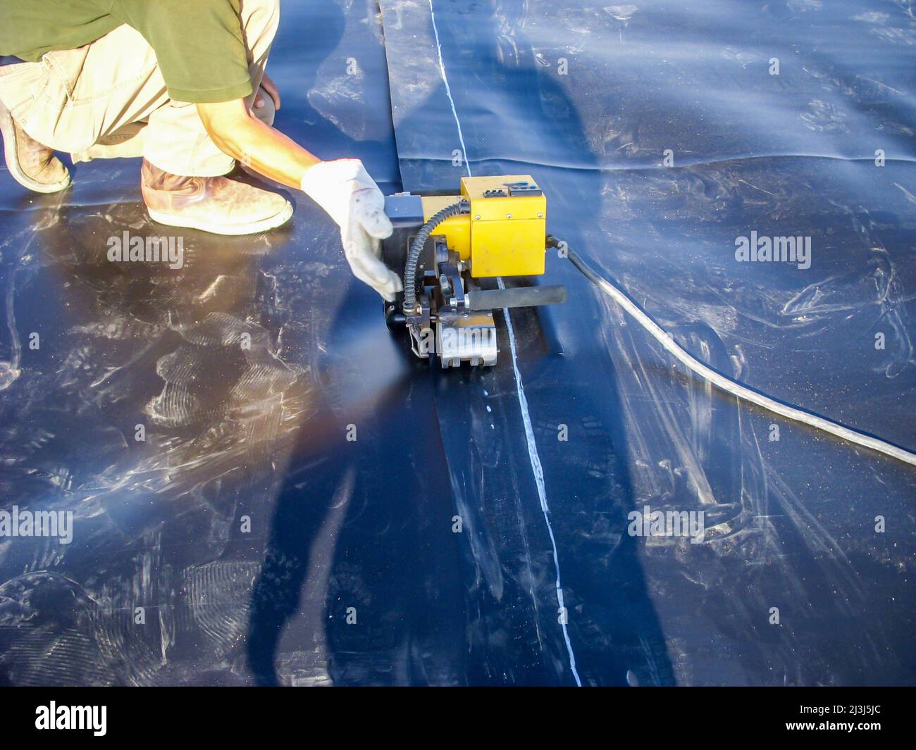 Joint between two HDPE liner sheets being hot welded together at a ...