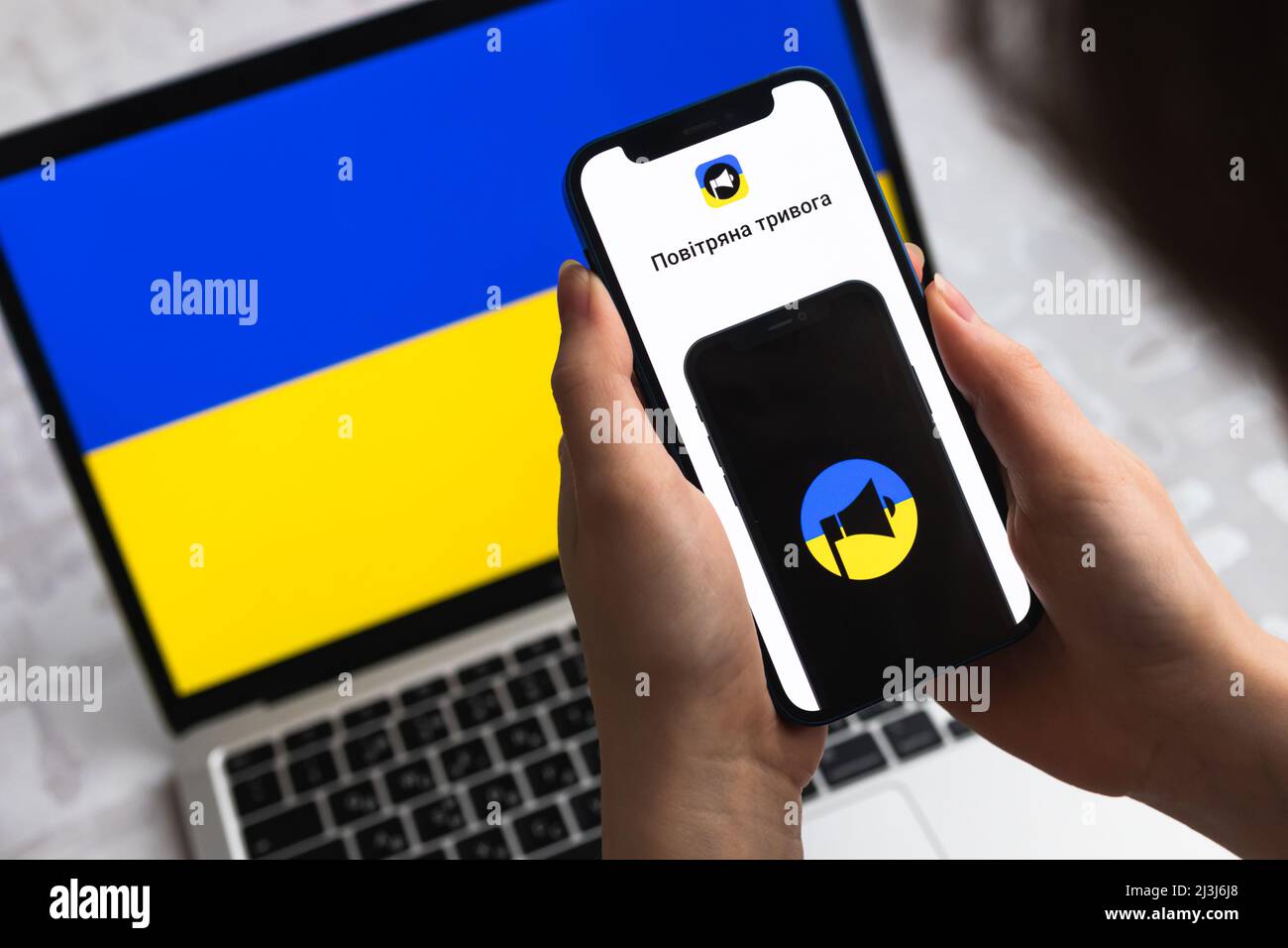 Poltava, Ukraine - April 8, 2022: Woman uses Air Raid Siren app for ...