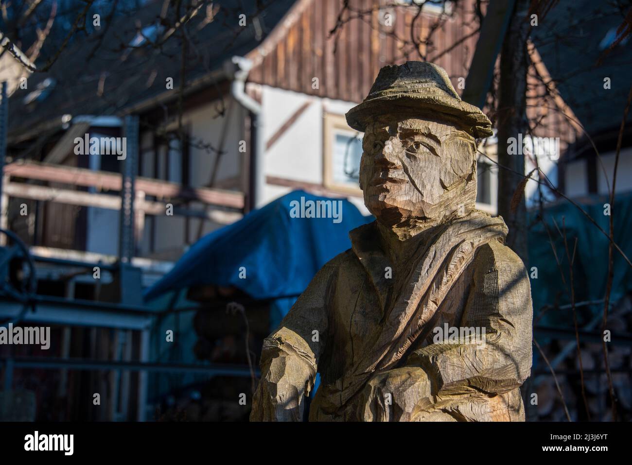 Sitting man made of wood, Schmilka, Saxony, Germany Stock Photo - Alamy