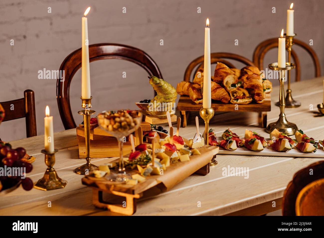 Group of friends or family members giving thanks to God at festive ...