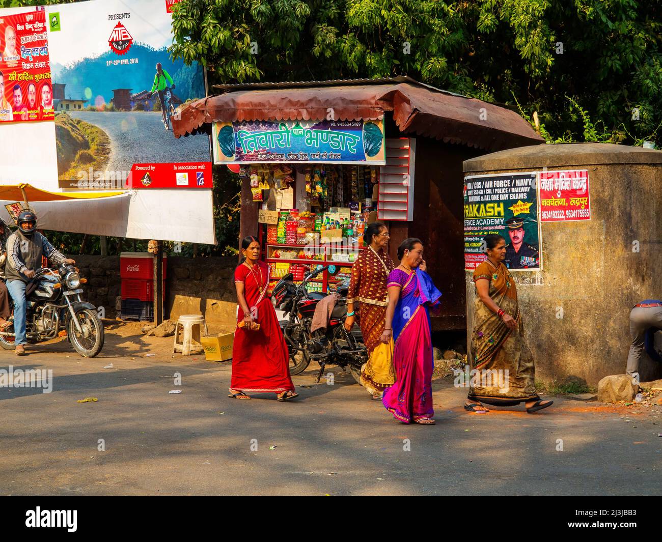 Indian woman with traditional clothes walking on the main road at ...