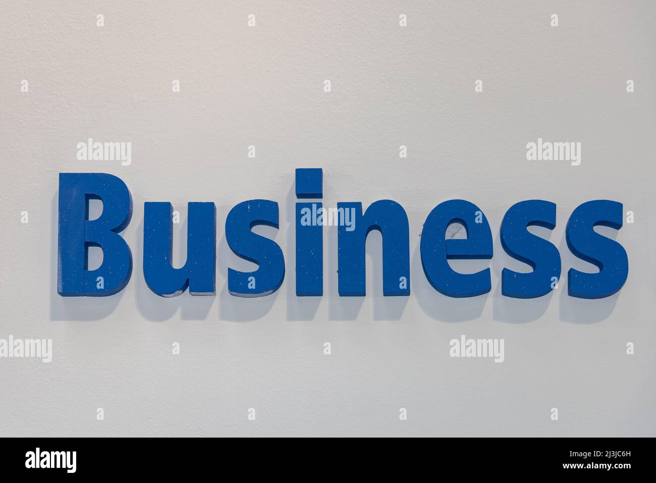 3d Letters Business Blue Sign at White Wall Stock Photo - Alamy