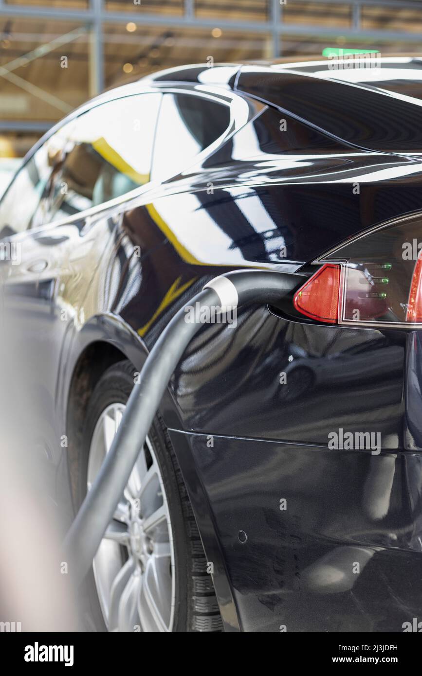 Dark blue Tesla Model S at a charging station in Germany Stock Photo ...