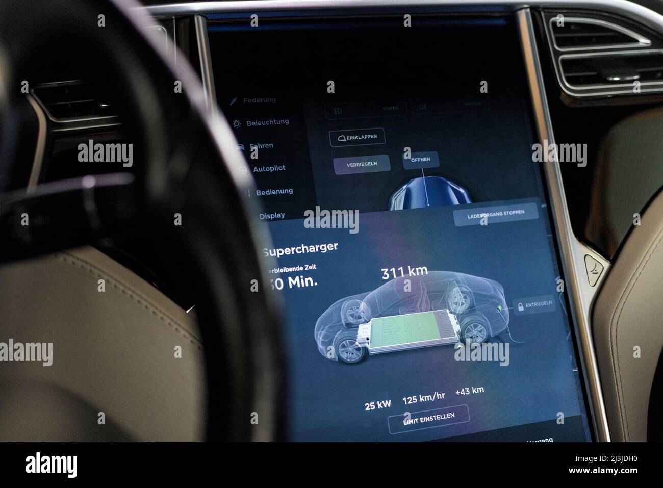 View inside the car during charging at a Tesla Supercharger station in ...