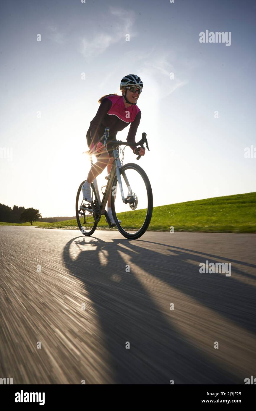 Woman on road racing hi-res stock photography and images - Alamy