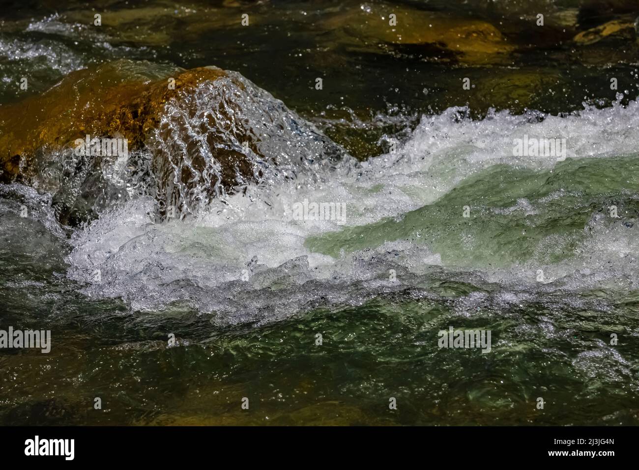 Fast-flowing Soda Butte Creek in the Absaroka Mountains of northeast ...
