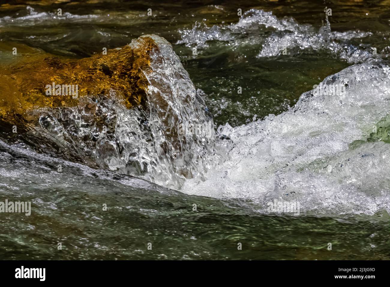 Fast-flowing Soda Butte Creek in the Absaroka Mountains of northeast ...