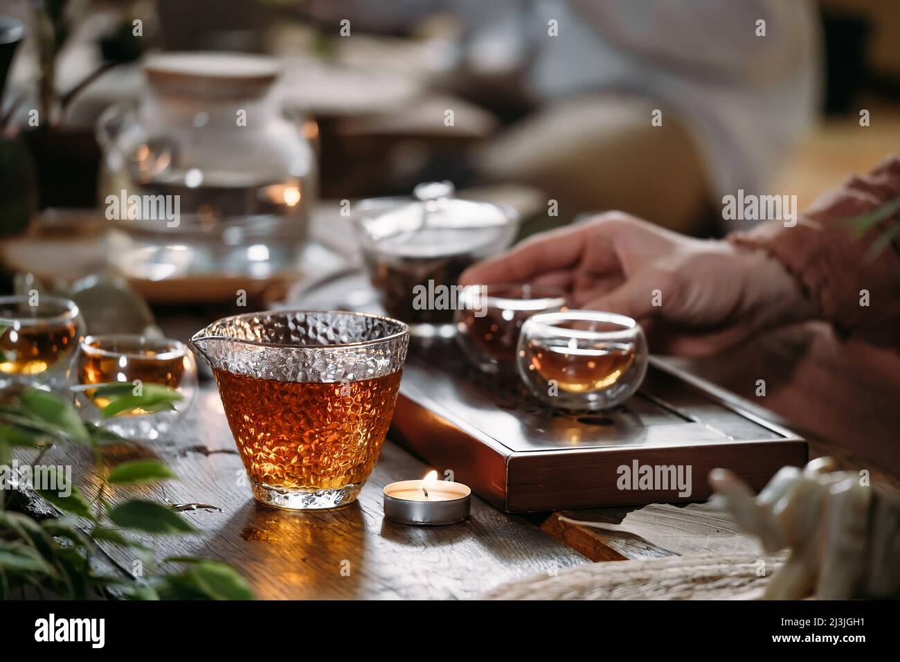 Traditional Chinese tea ceremony Gun Fu Cha and pouring oolong from a ...