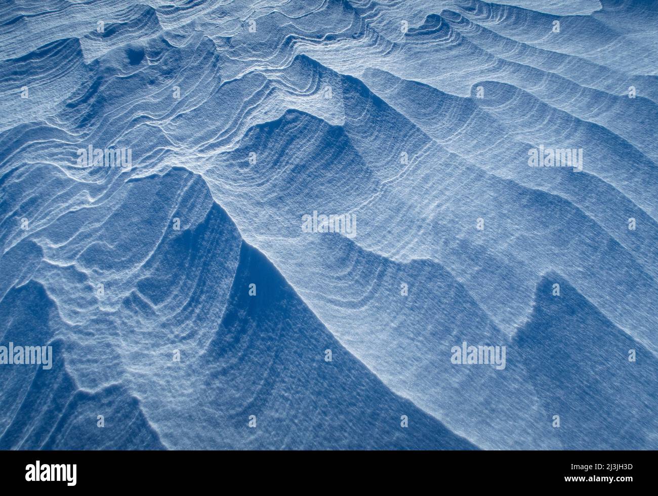 seasonal abstract background blue wavy snow surface Stock Photo - Alamy