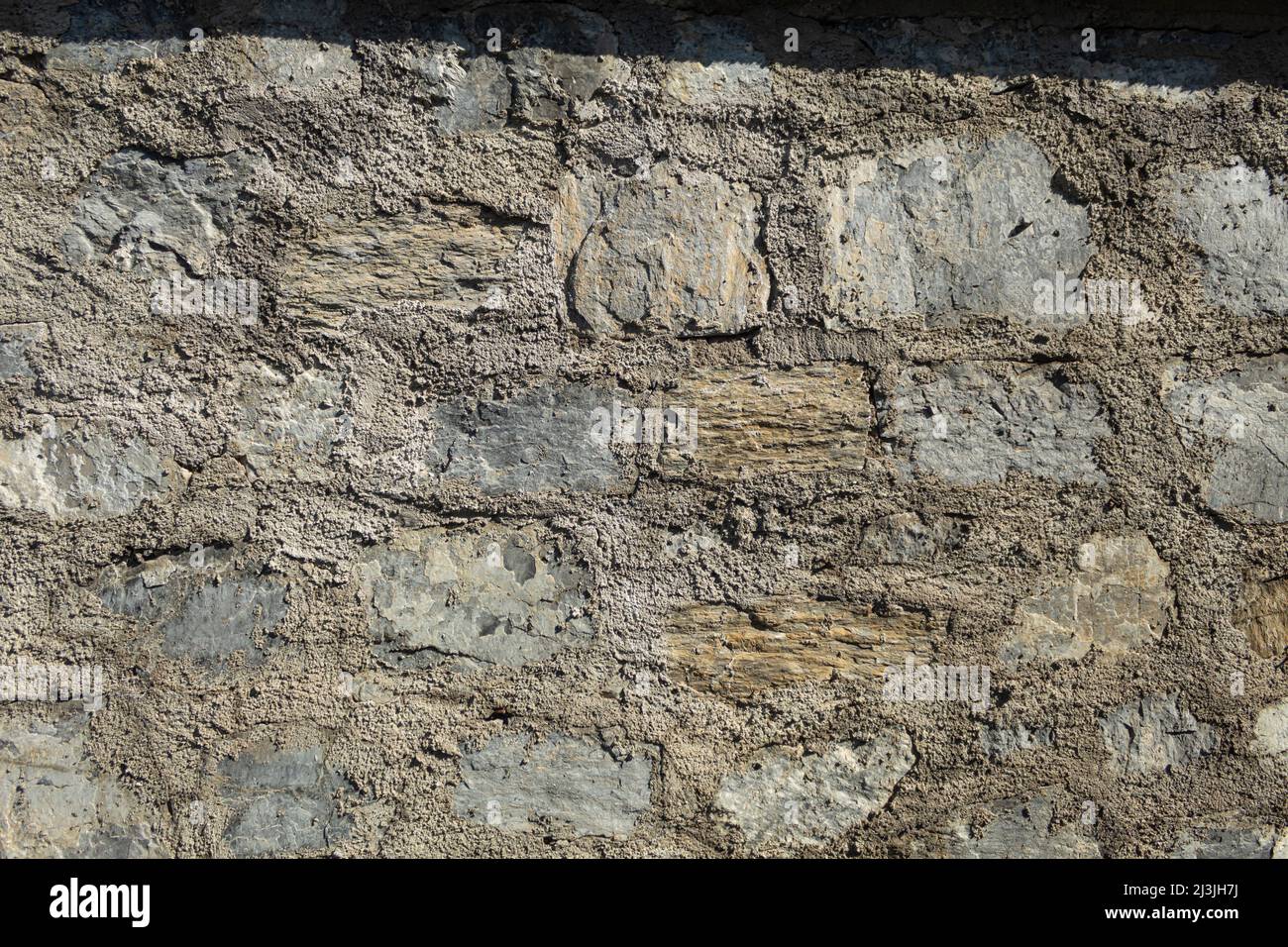 Wall element, large granite stone and concrete. Background texture ...