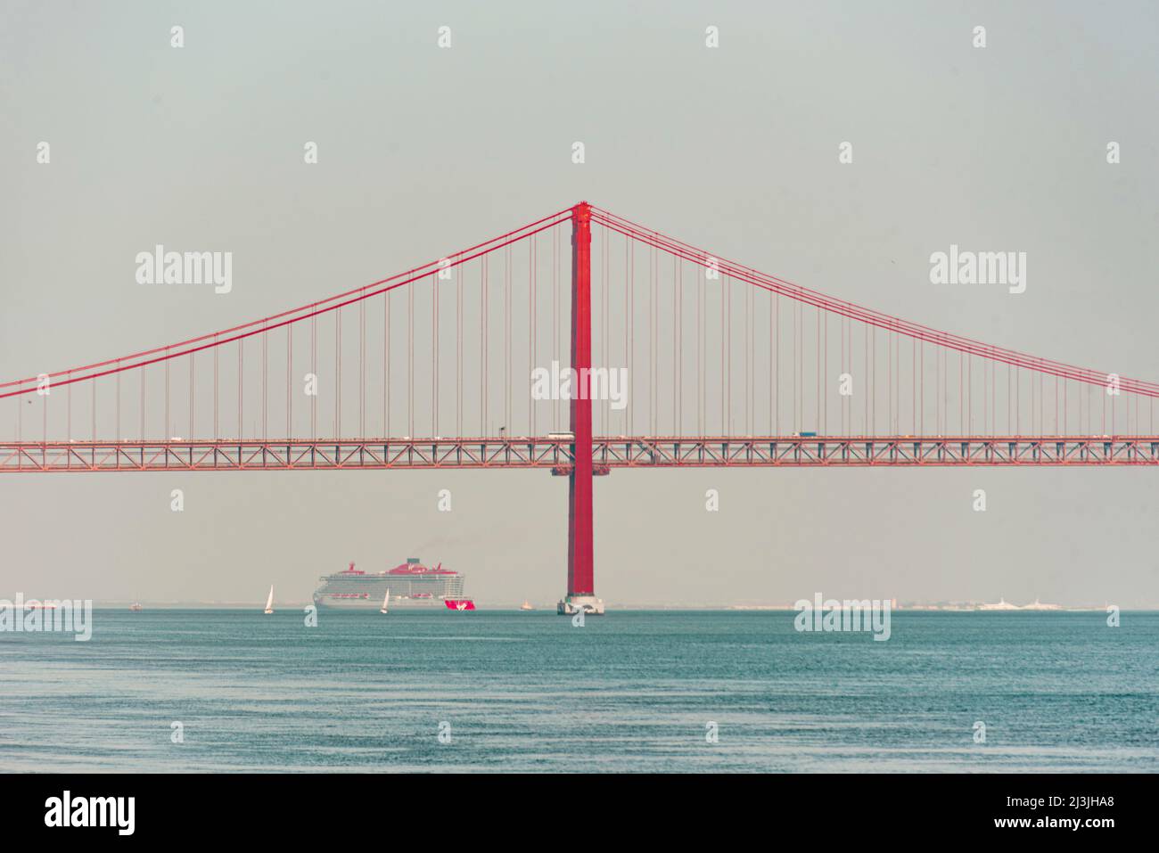The 25 de Abril Bridge supension bridge of Lisbon at Sunset. Beautiful ...