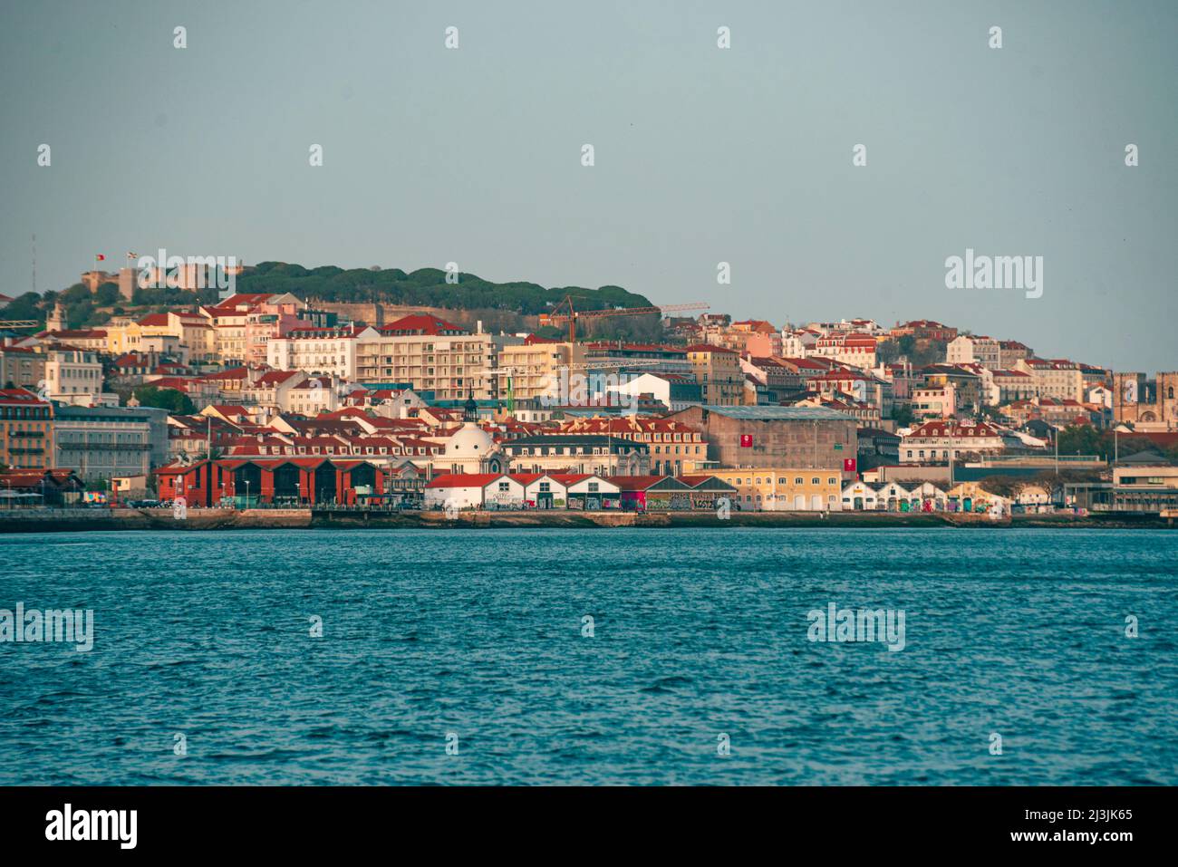 Beautiful skyline of Lisbon view from the water. Turquoise blue river ...