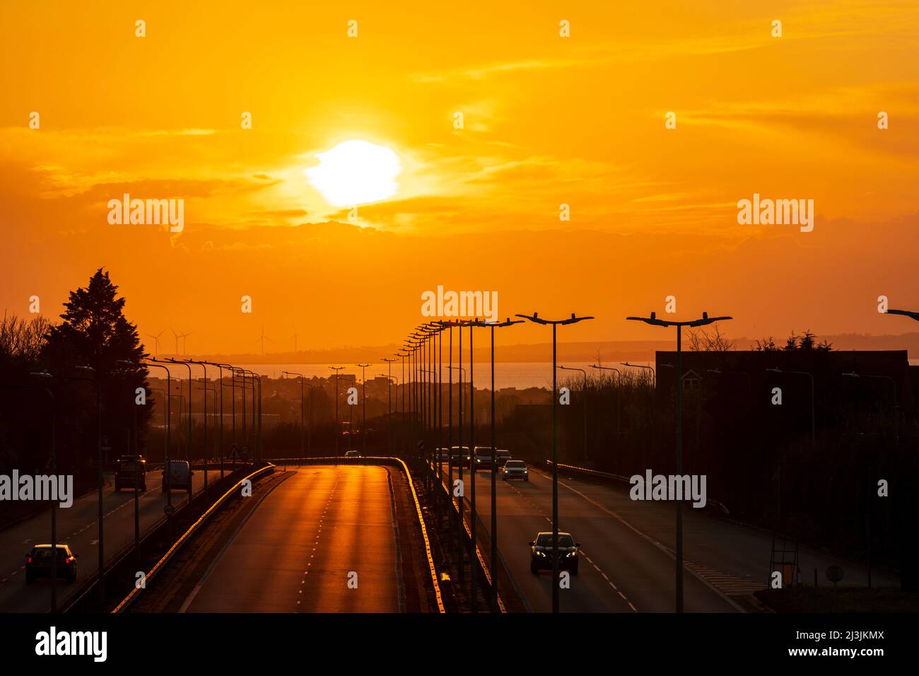 Sunset over traffic on the Thanet Way, A299, an English dual ...