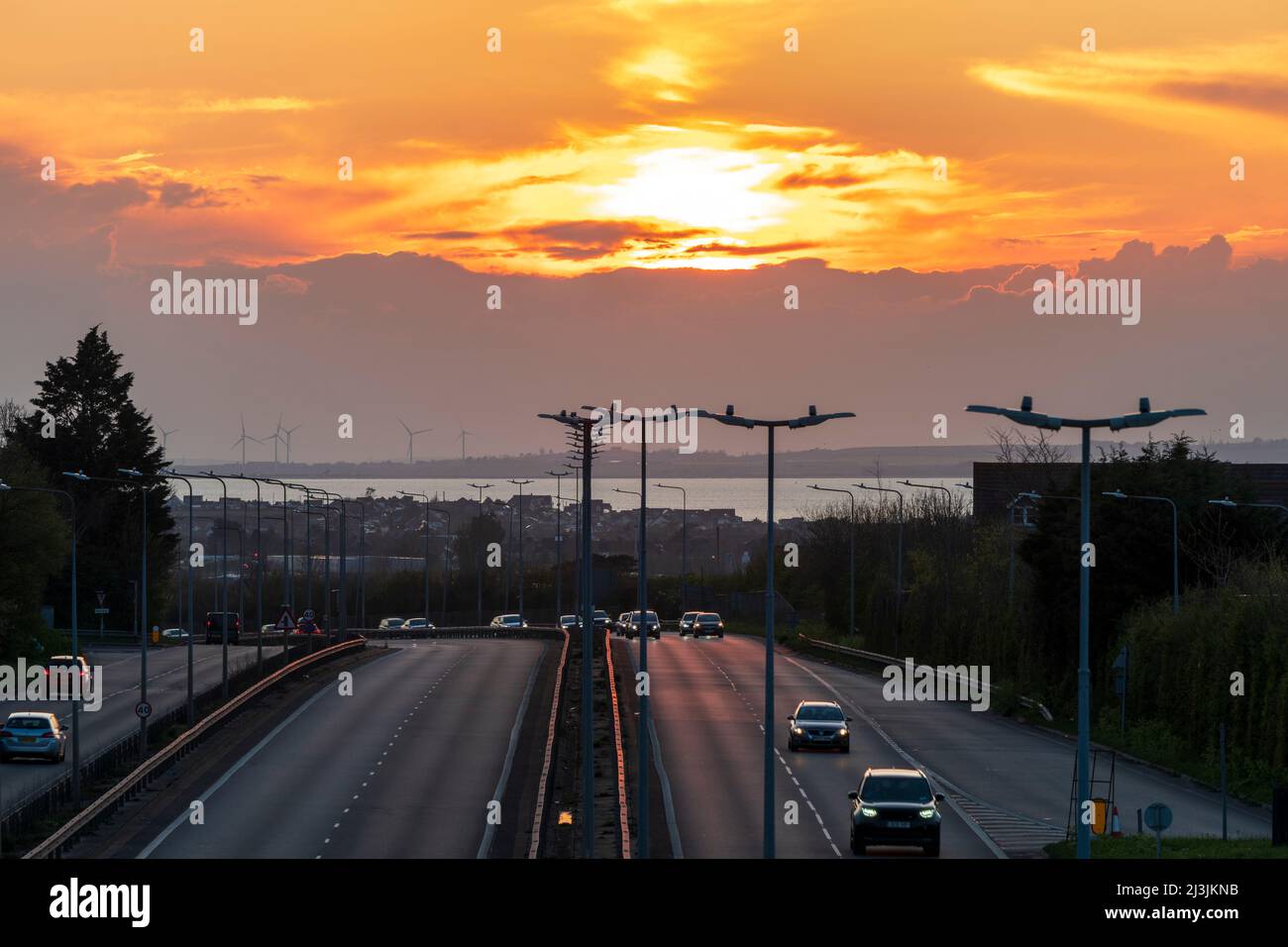 Sunset over traffic on the Thanet Way, A299, an English dual ...