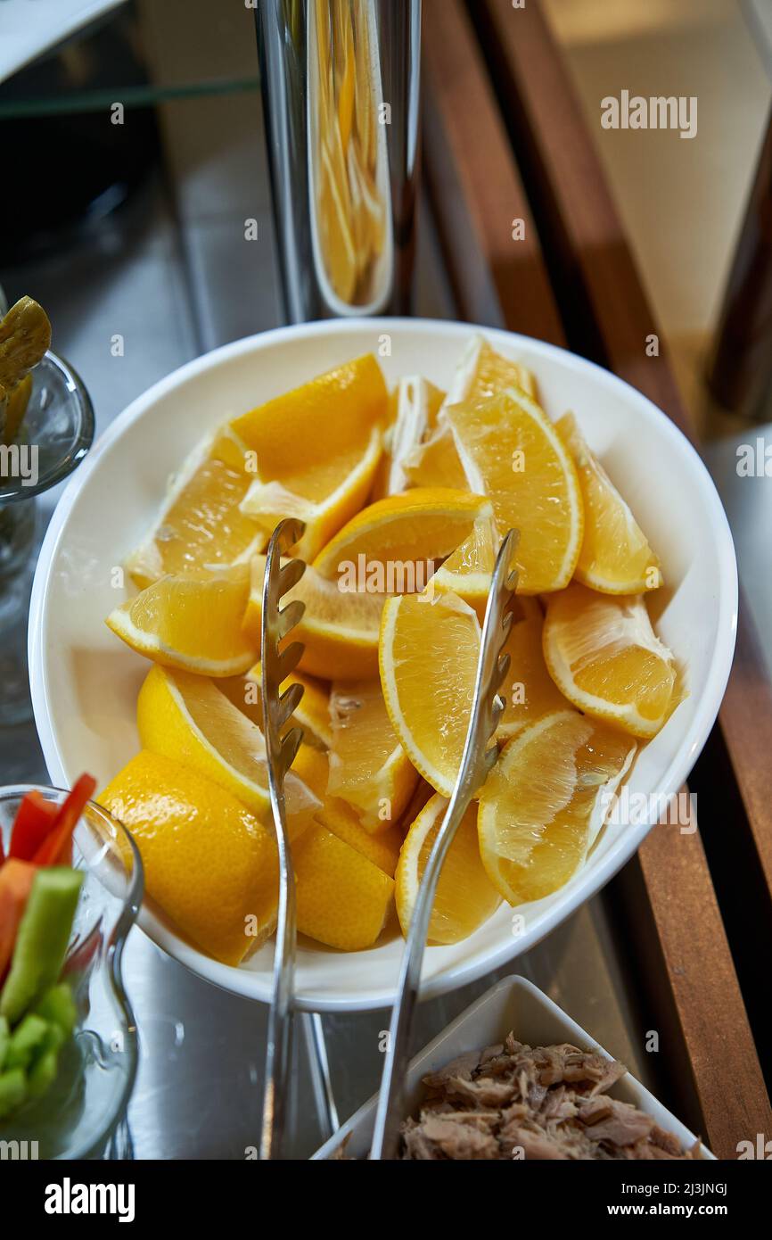 Cut lemon wedges hi-res stock photography and images - Alamy