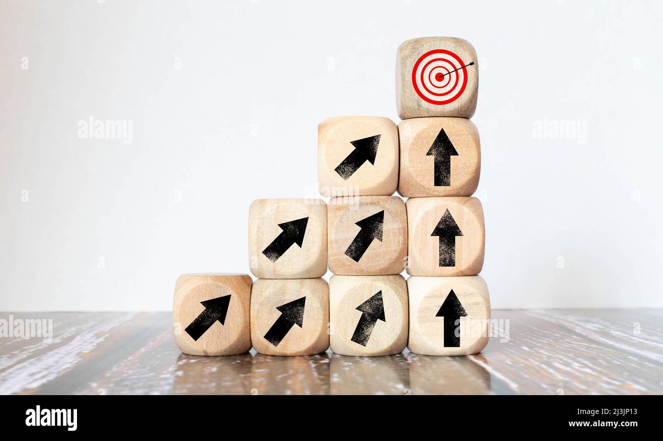 Wood block red arrow pointing the opposite way disruptive from the ...