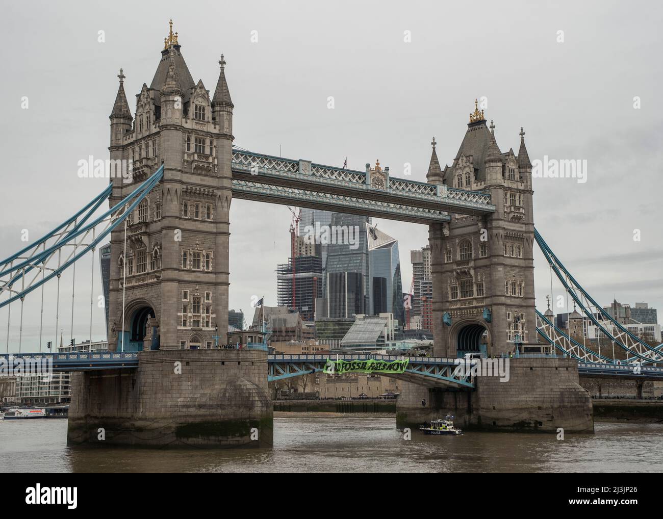 Extinction Rebellion protesters suspend themselves by ropes beneath ...