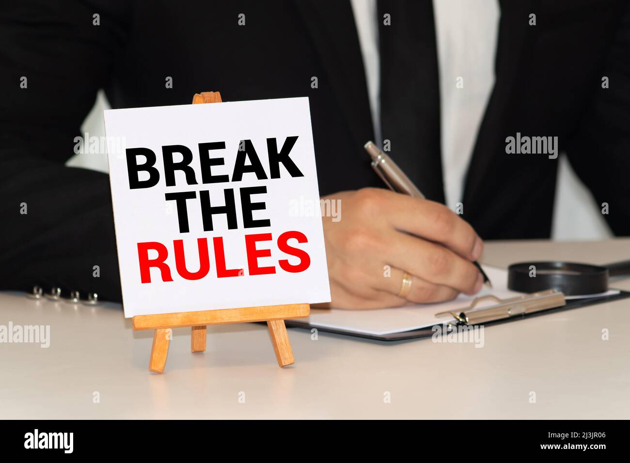 Closeup businesswoman hands holding white card sign with break the ...
