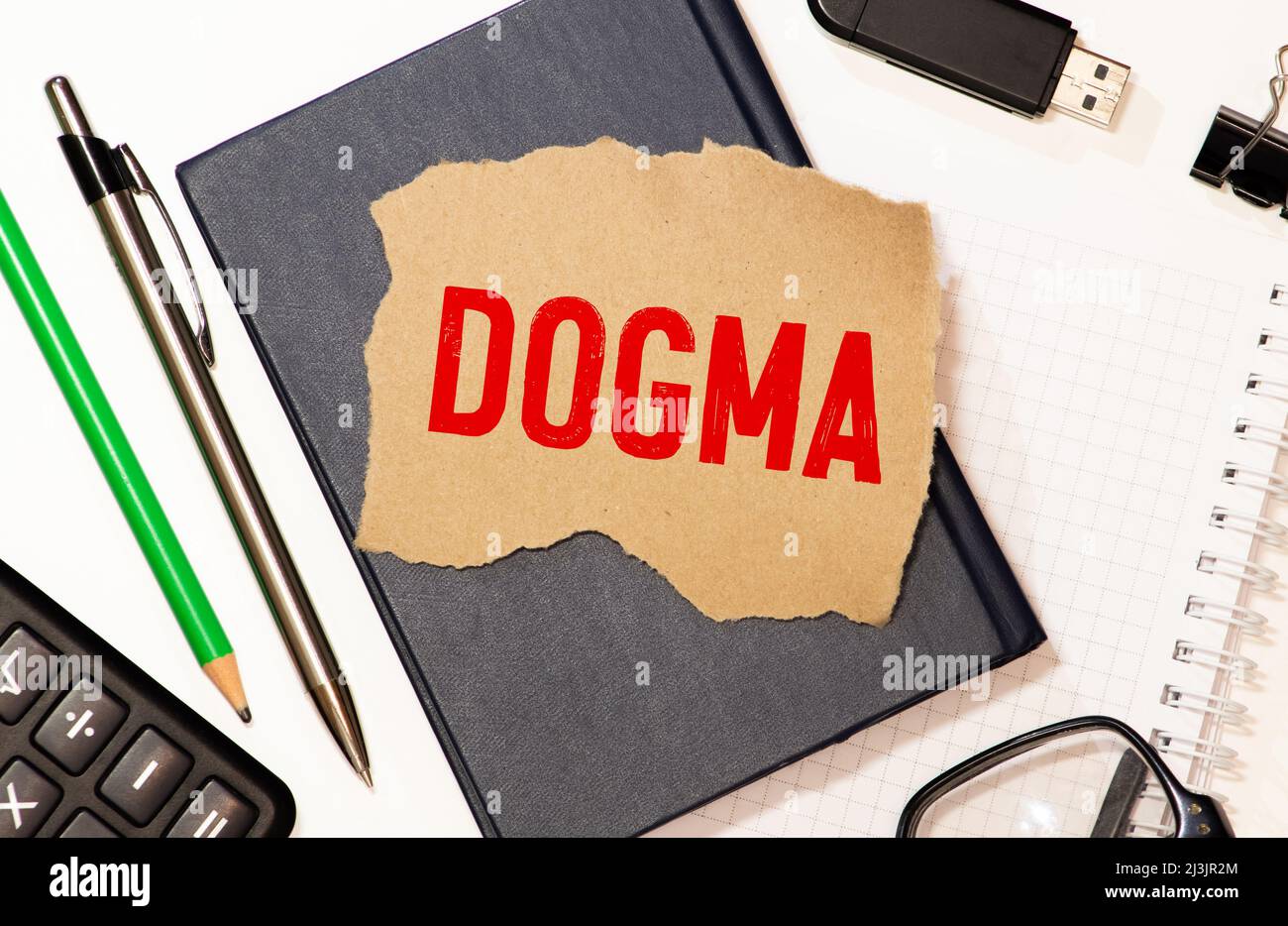 word dogma printed on white paper macro Stock Photo - Alamy