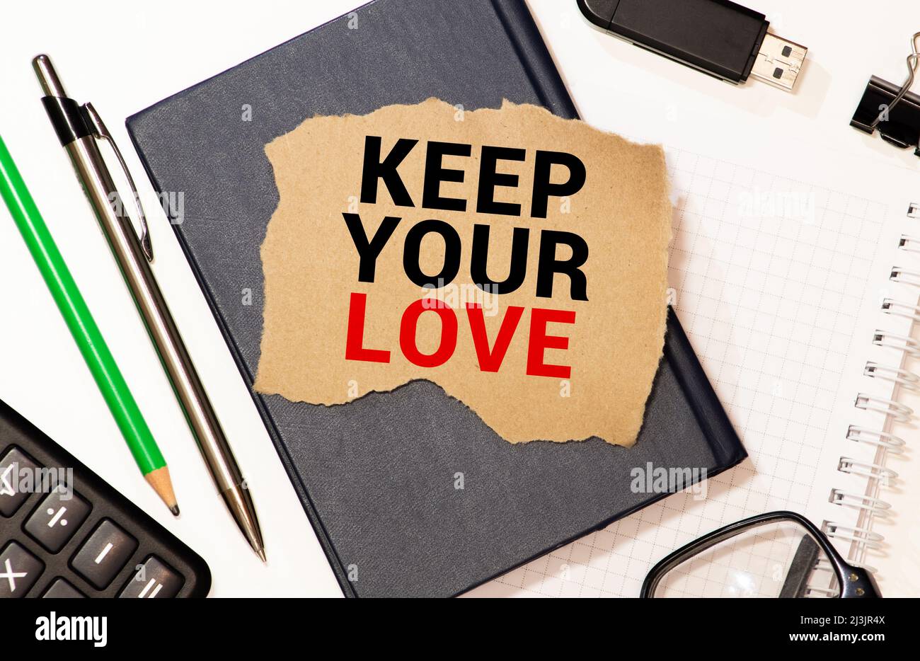 Keep it real text concept write on notebook with pen Stock Photo - Alamy