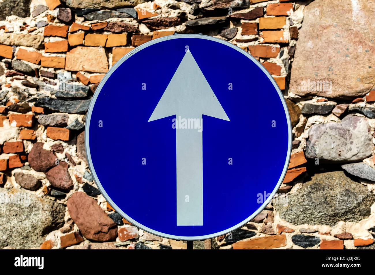 Blue traffic sign white arrow hi-res stock photography and images - Alamy